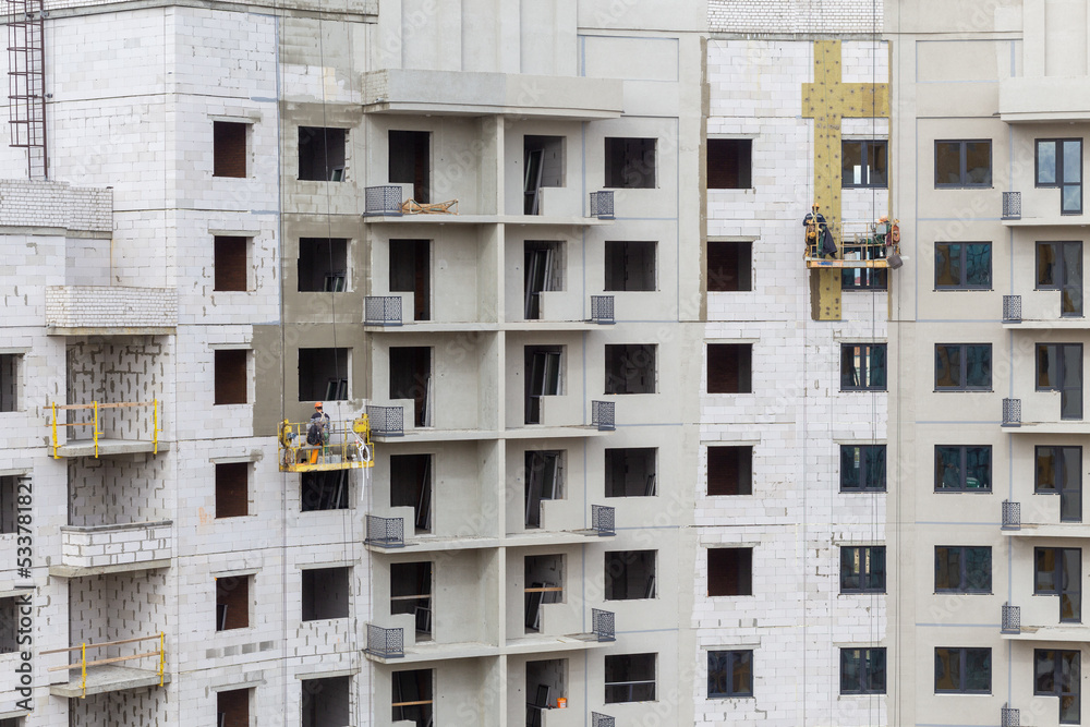 The process of insulating external walls in a multi-storey building ...