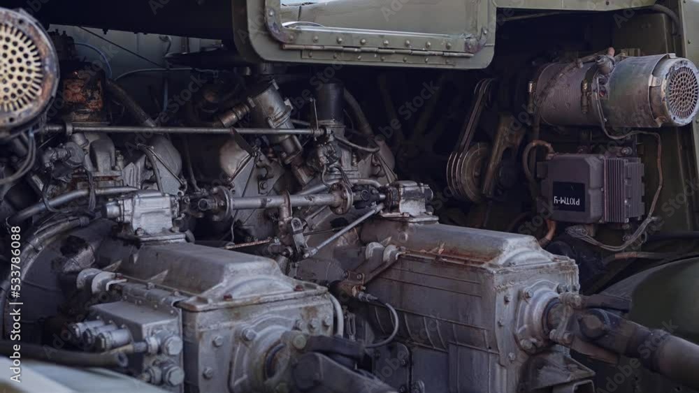 Internal parts and the engine of an old military tractor. Shooting in ...
