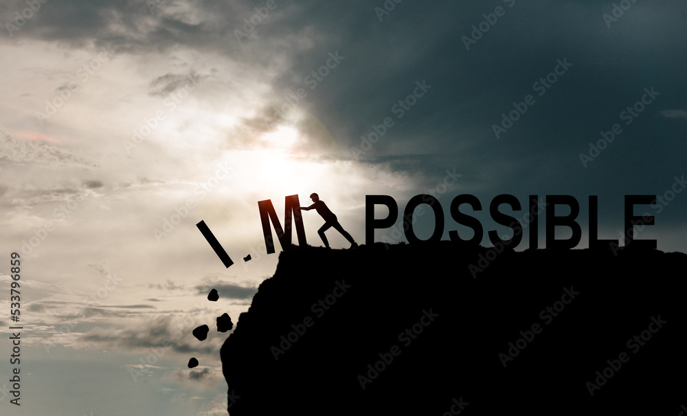 Businessman push impossible wording to possible wording on top of ...