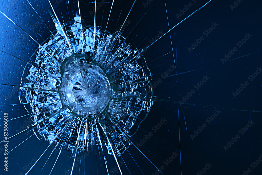 cracks on the glass impact on the glass, abstract background broken ...