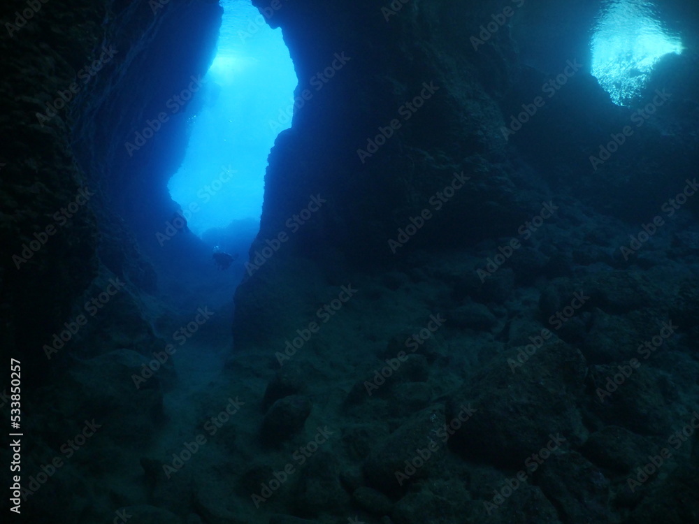 exploring and enjoying the caves underwater cave dive blue background ...