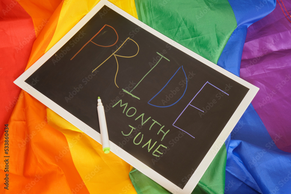 LGBT Pride Month in June. inscription pride on black board on lgbt ...
