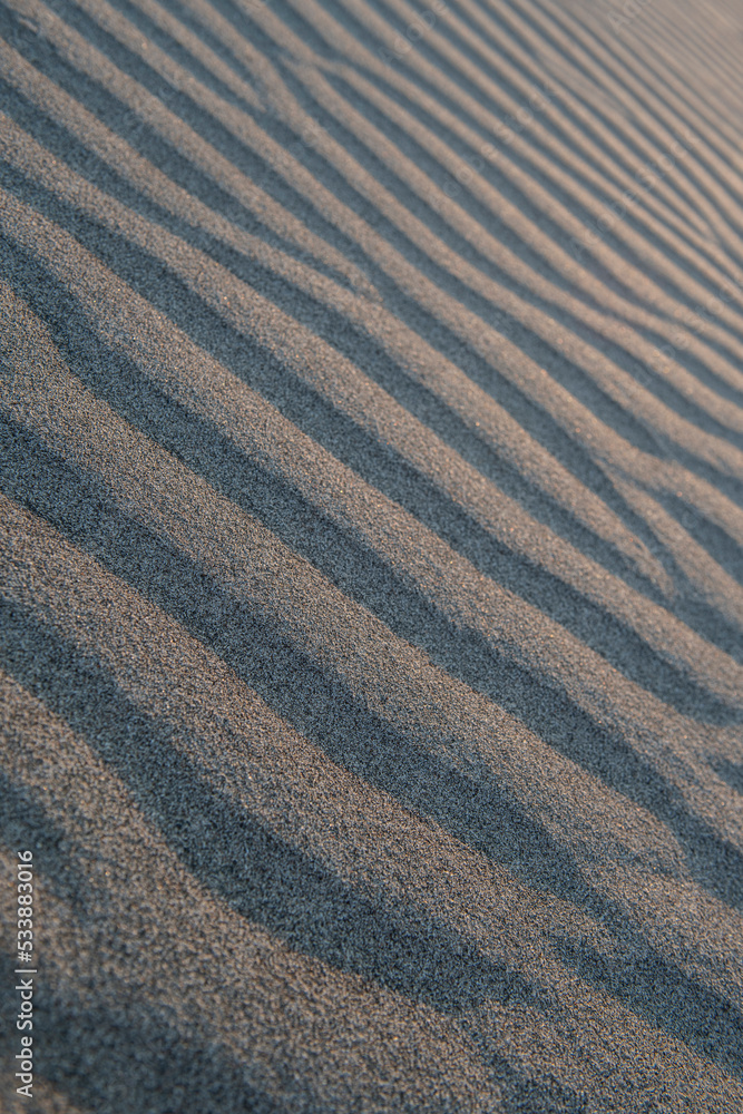 Beach sand. Wavy sand, sand formed by the wind in the form of an ...