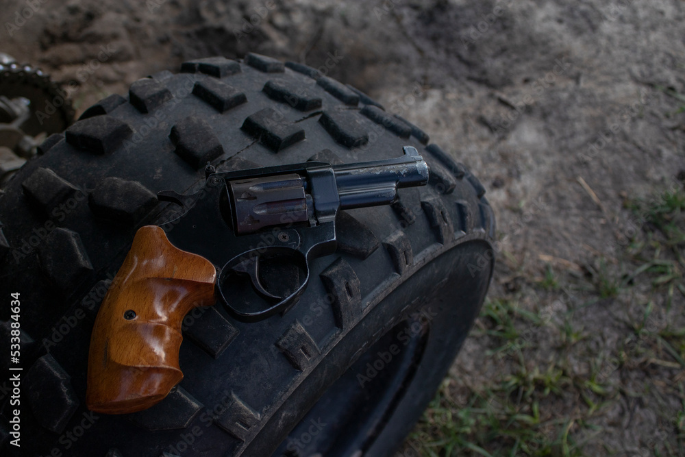 Black Automatic Firearm. Top view of a pistol and cartridge with ...