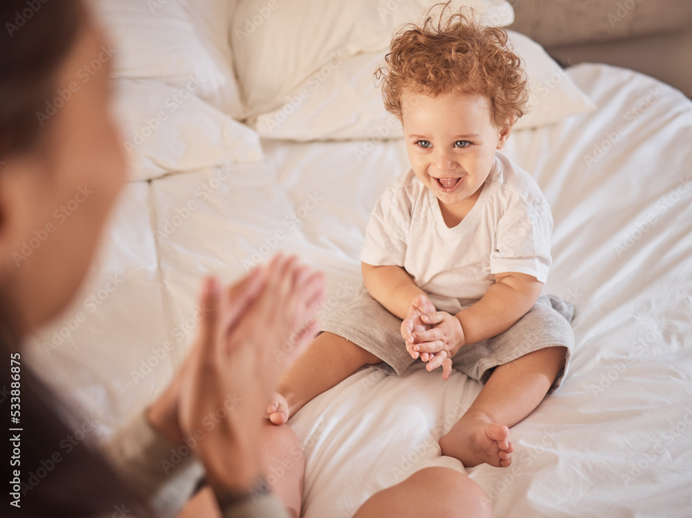 Baby, family and child clapping hands, happy and having fun on bed ...