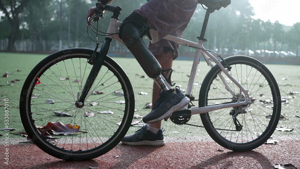 Sportman amputee wearing prosthetic leg. A disabled person standing ...