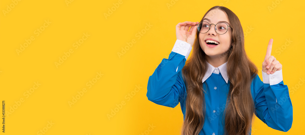 Clever idea. Clever girl in eyeglasses yellow background. School age ...