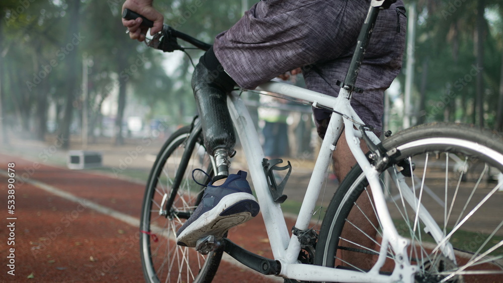 Disabled amputee on bicycle wearing prosthetic leg on stand by Stock ...