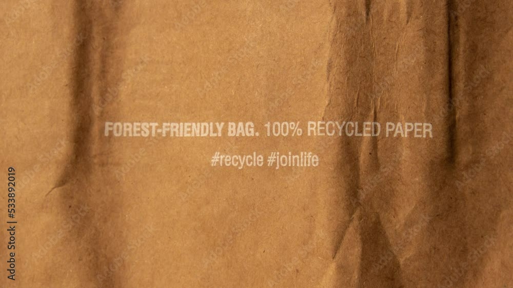 Vídeo do Stock: 4k zoom in out Forest friendly bag Brown paper bag that ...