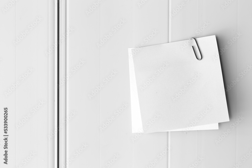 The white door with metal doorknob is lock and sticker paper note on ...