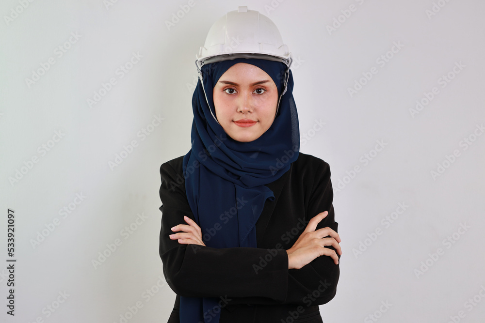 Happy and smart muslim asian engineer standing and arms cross with ...