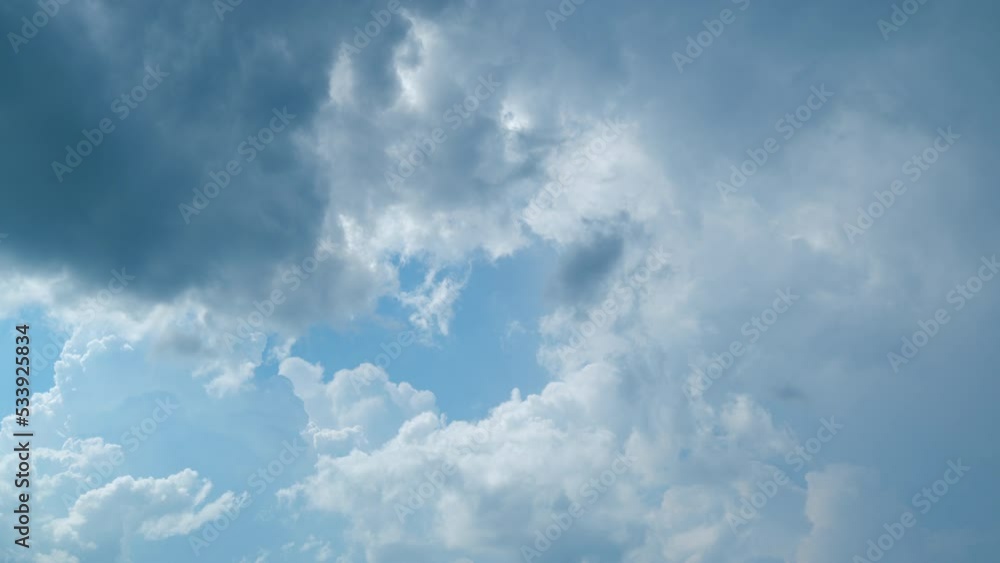 Blue sky with cumulonimbus rain cloud formations and sunlight. Foam bomb of exploding cloud ...