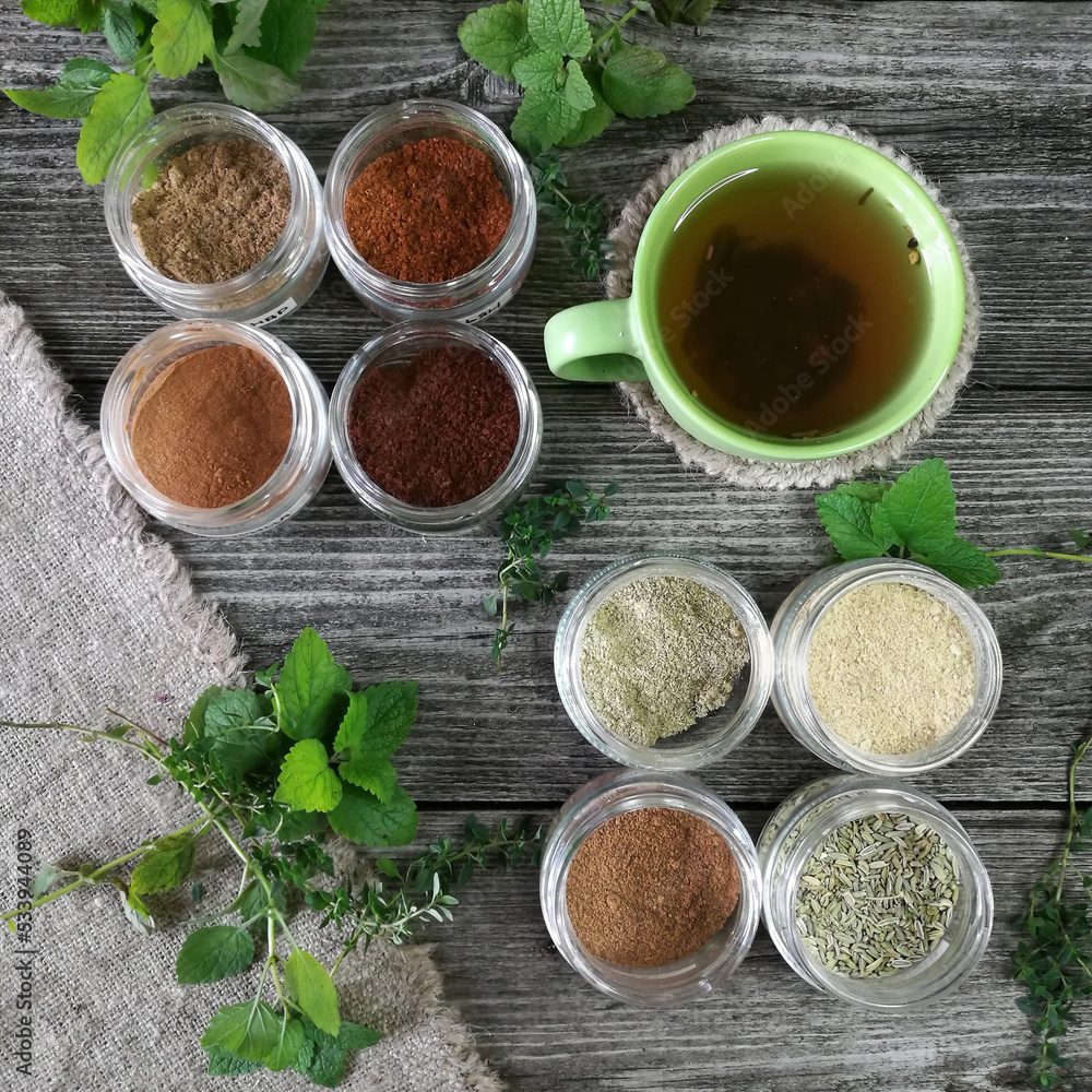 Cup of tea with dry tea collection of different types of herbs and ...