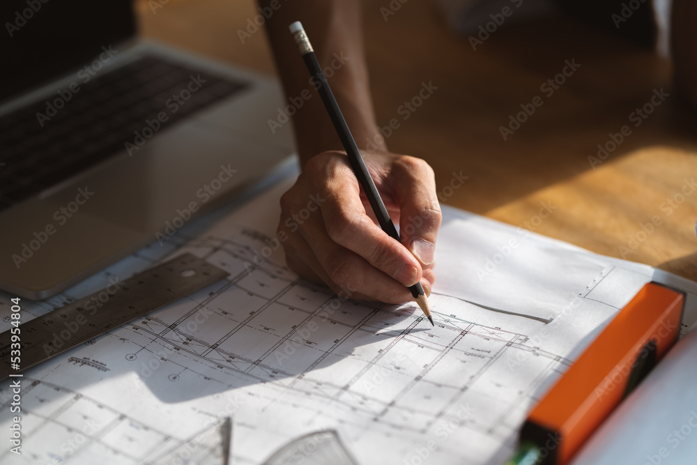 Architect & Engineer working drawing blueprint document about project ...