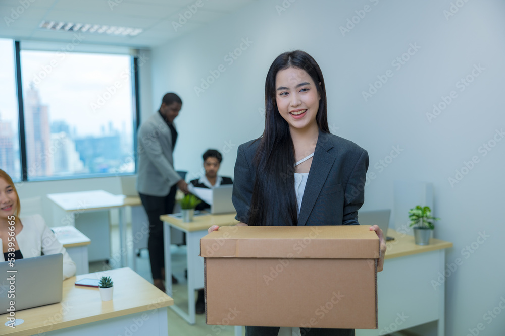 New colleague is coming into the office. Asian woman coming to the ...