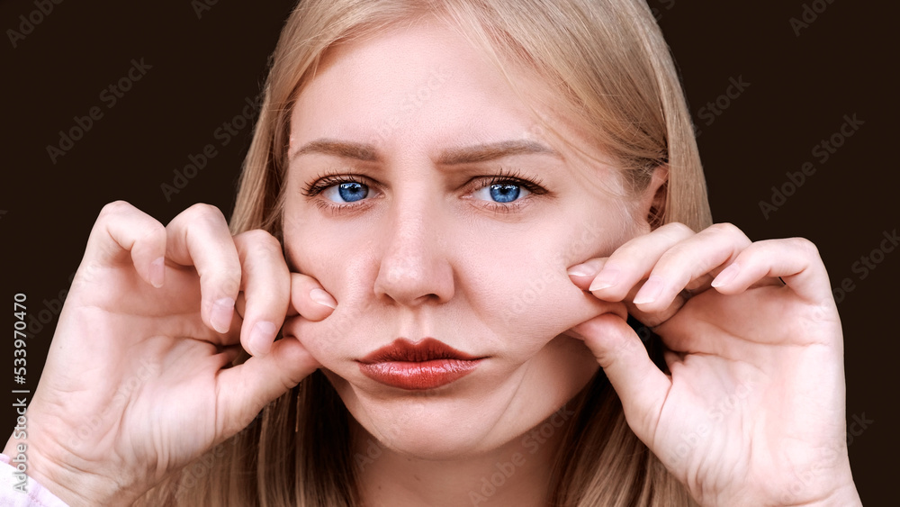 Second chin, obesity. Portrait of a 30-year-old woman pulling back the ...