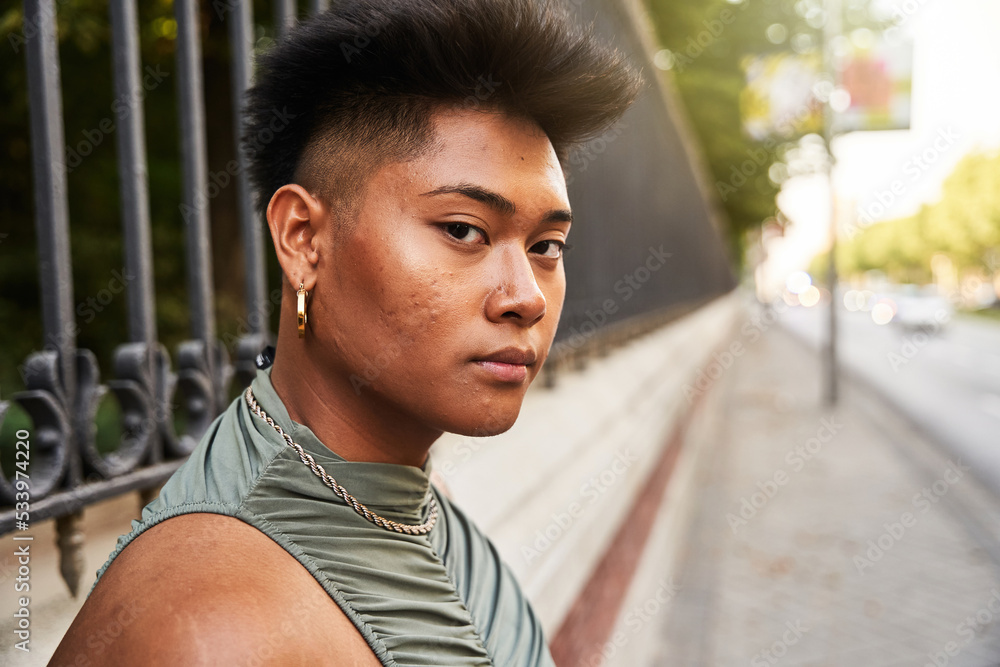 Non binary Filipino person looking at camera Stock Photo | Adobe Stock