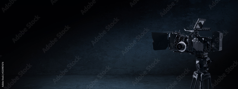 Photo & Art Print Digital movie camera in dark concrete room with light ...