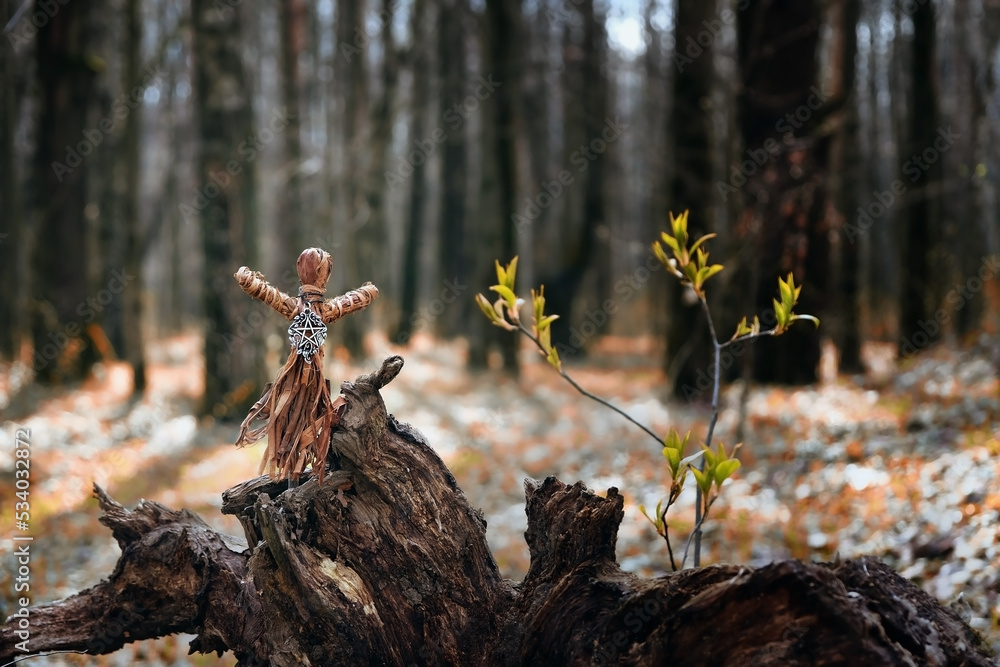magic witchcraft doll made of tree bast in autumn forest, natural ...