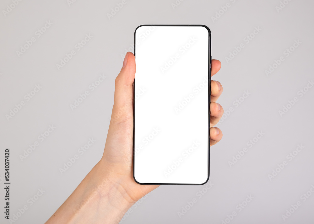 Hand holding abstract mobile phone mockup, empty blank white screen ...