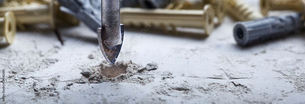 Ceramic drill bit make holes in concrete wall with industrial drill ...