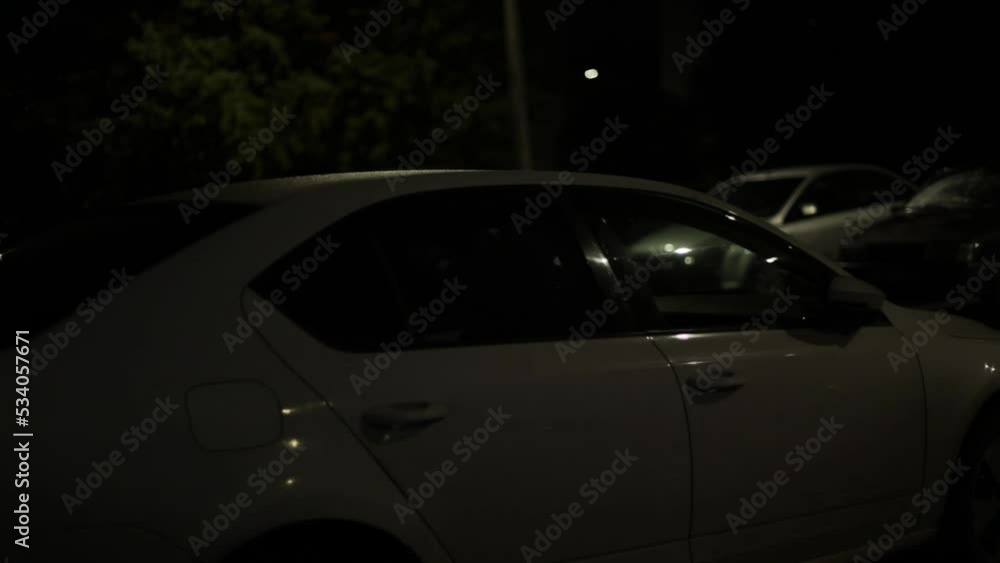 Vidéo Stock Car in dark in parking lot. Transport costs at night in ...