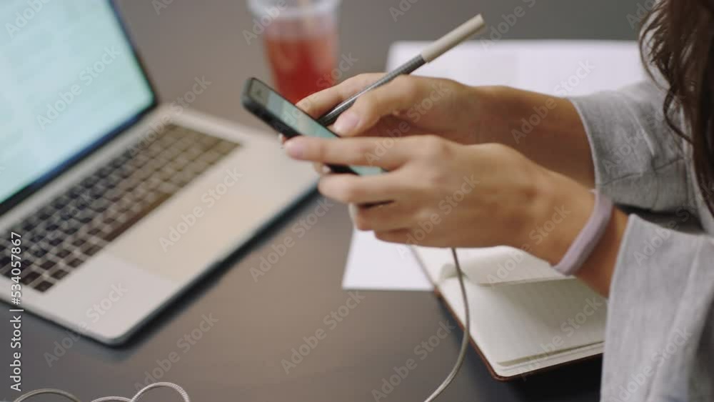 Student phone, education and course in home writing down notes in her ...