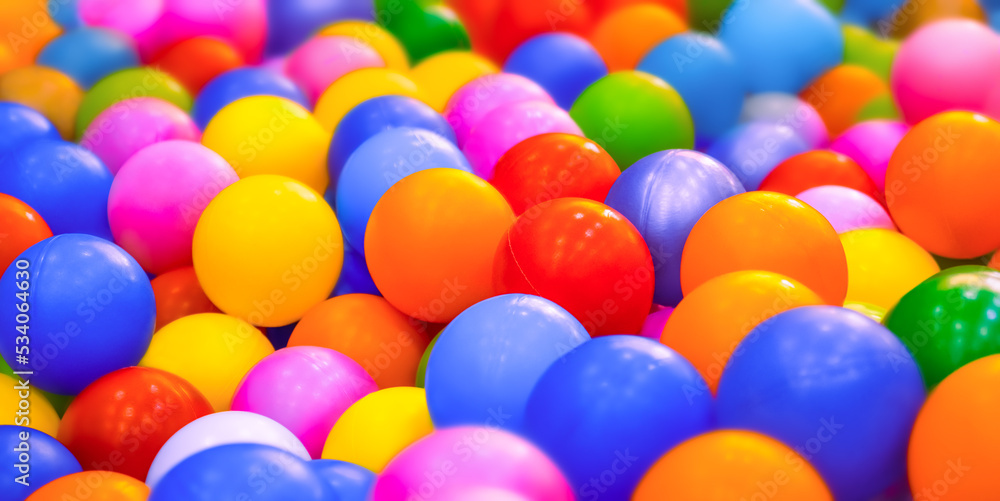 Dry pool or kids ball pit. Many colorful balls background playground ...