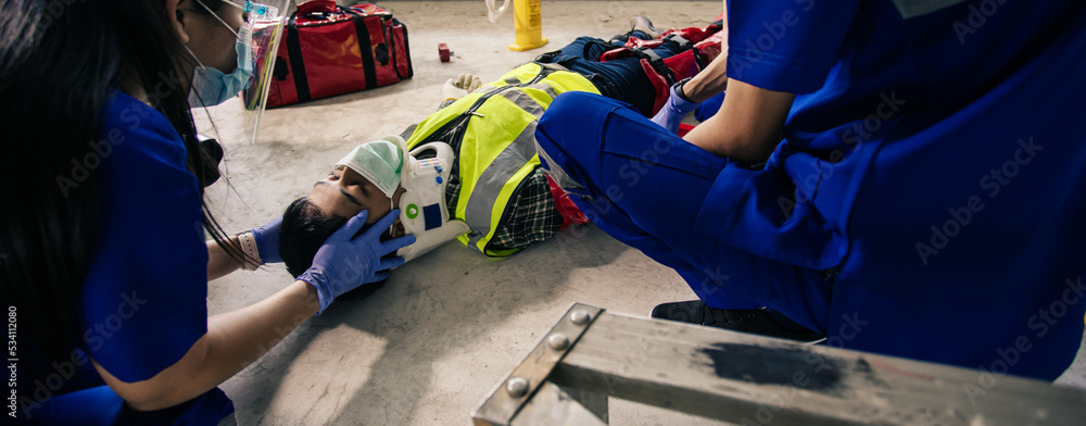 Employee accident in construction site work. Team EMS Paramedic first ...