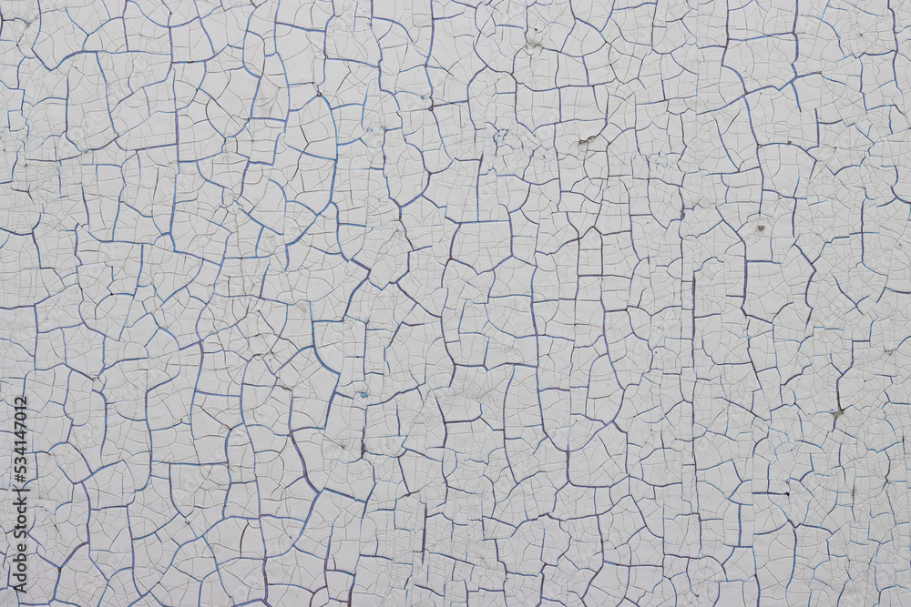 White peeling paint on the wall. Old concrete wall with cracked flaking ...