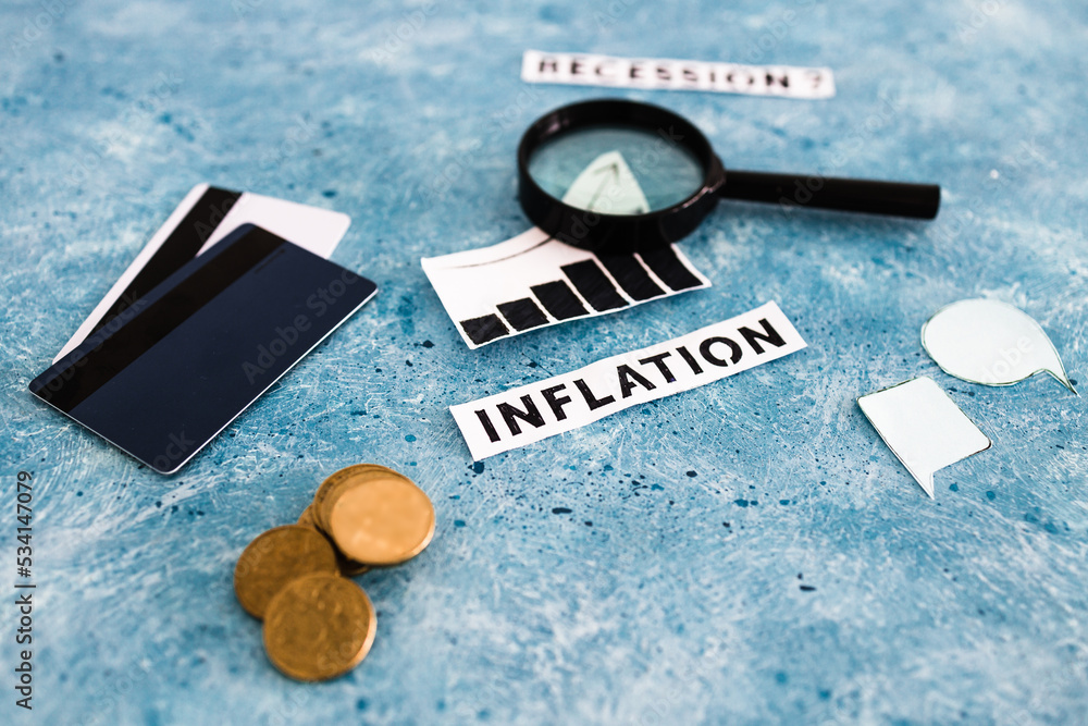 inflation text and graph showing prices going up with magnifying glass ...