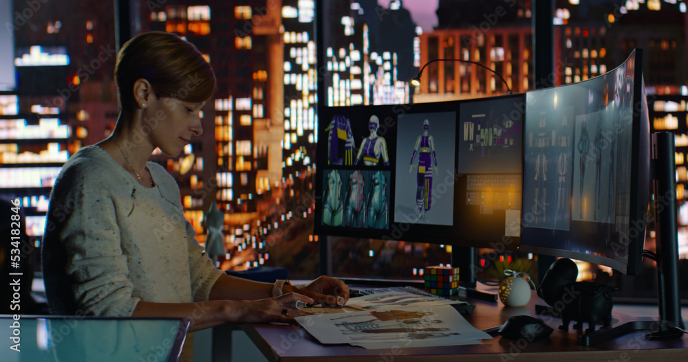 Female Fashion Designer Working in Her Home Studio. Young Woman ...