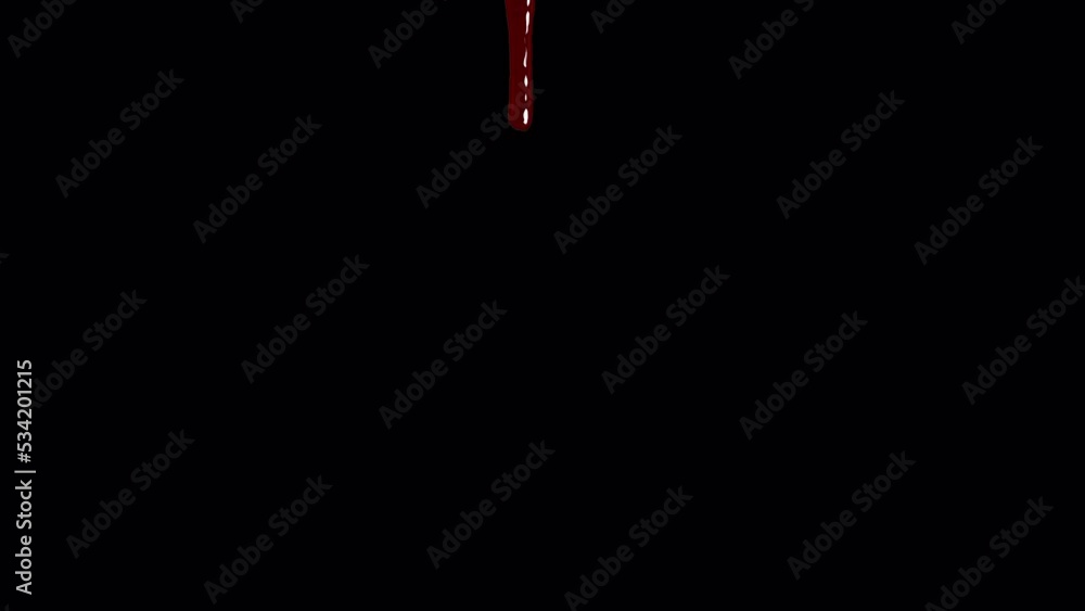 A single drop of blood dripping down the frame on a transparent alpha ...