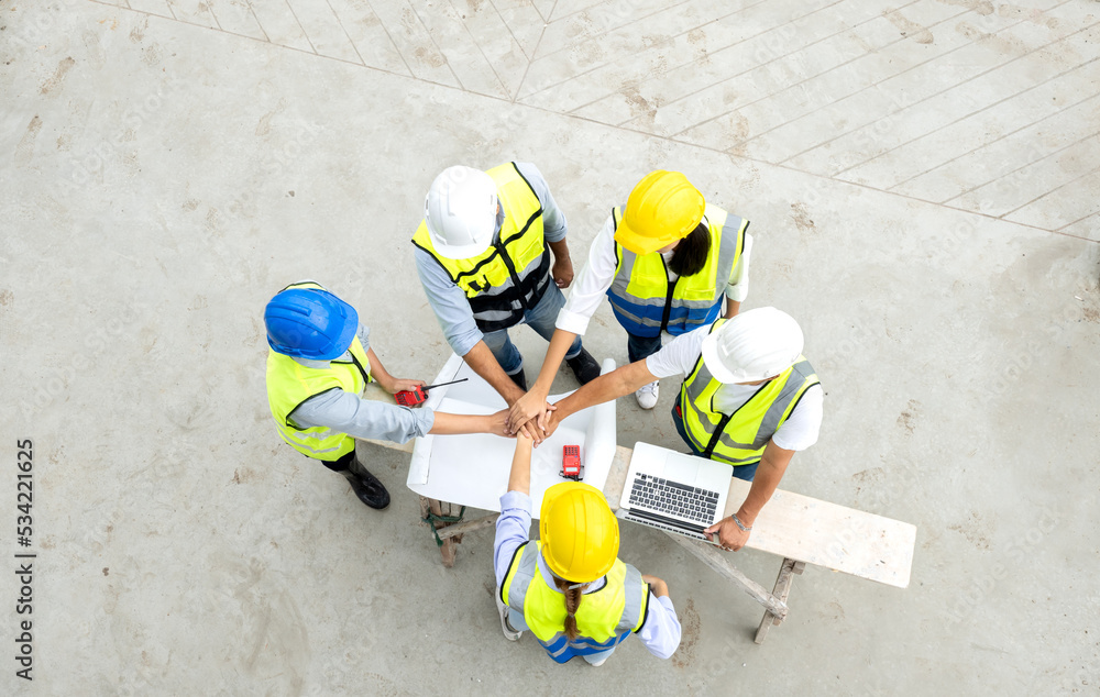 Engineer man and architect teamwork wear safety helmet meeting at ...