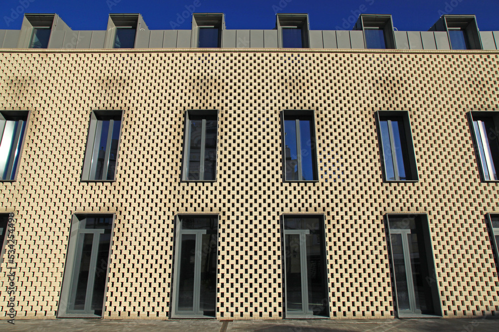 Hinged and ventilated facade. Honeycomb and mosaic form of building ...