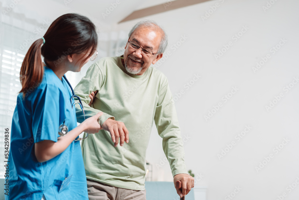 Asian senior elderly man patient doing physical therapy with caregiver ...