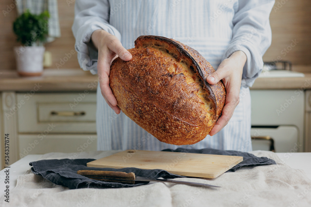 woman cooks homemade yeast-free sourdough bread. Healthy food. a woman ...