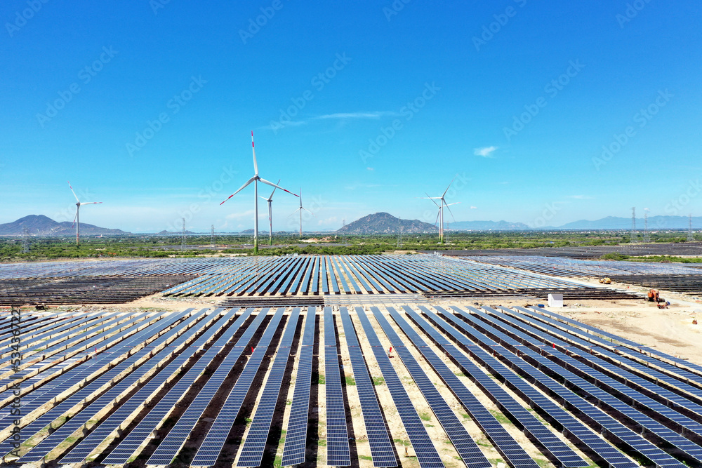 Solar panels and wind turbines generating alternative power and green ...