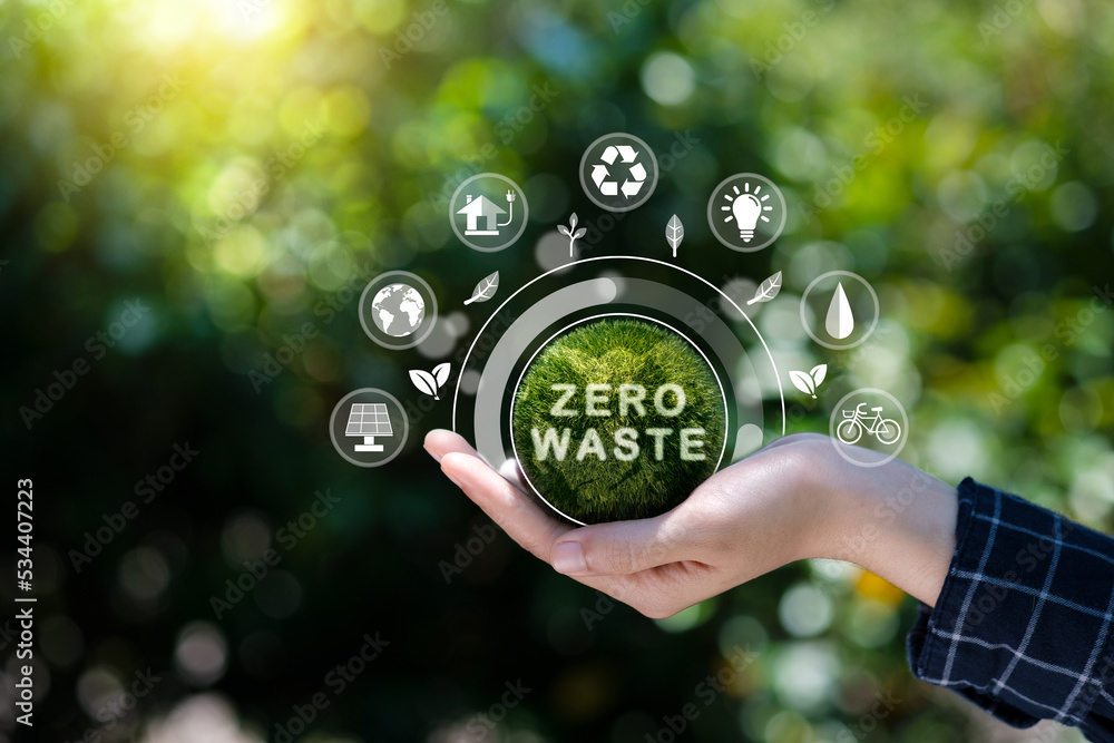 Hand of human holding green earth Zero Waste icon. recycle and reusable ...