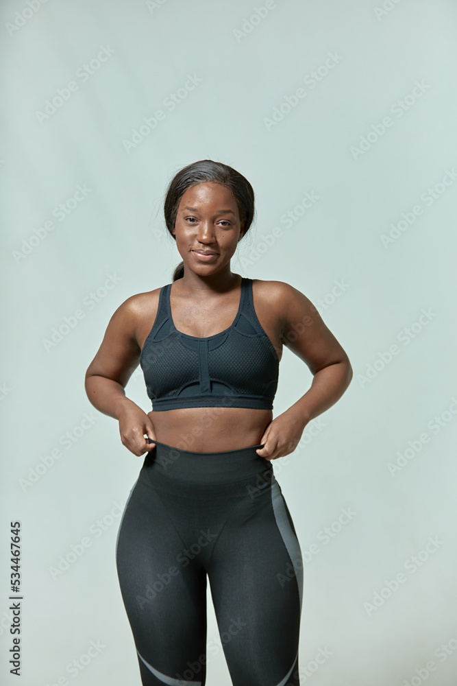 Body positive. Stylish plus size african american girl wearing sportive ...
