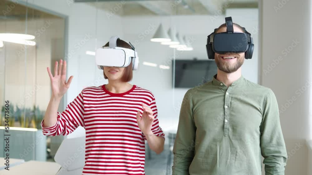 Close up portrait of two people man and woman standing in office ...