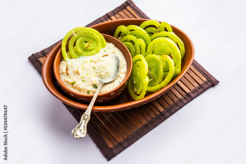 Rabdi Jalebi - Green jilebi or imarati with Rabri made from condensing ...