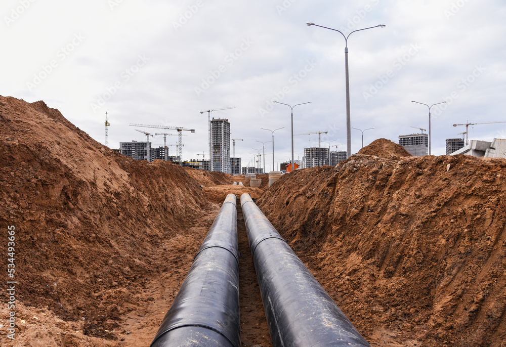 Stockfoto Sewer construction. Laying of storm sewer pipes at the ...