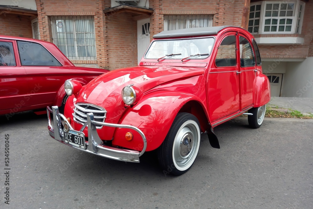old red popular Citroen 3CV 1960-1979 four door sedan parked on the ...