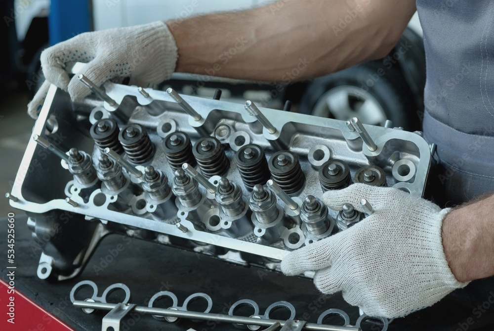 Car parts. The cylinder head of the internal combustion engine. An auto ...