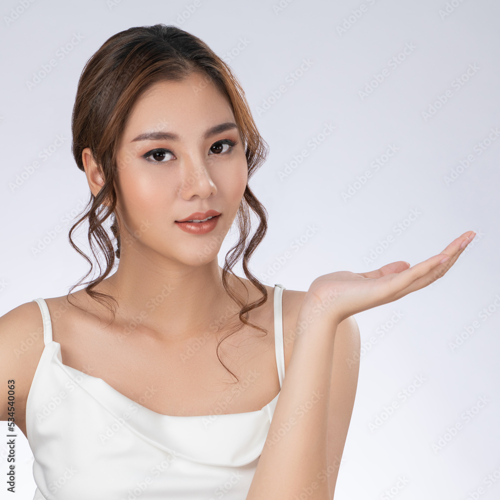 Photo of a gorgeous woman with flawless healthy fresh skin in a concept of empty space for ...