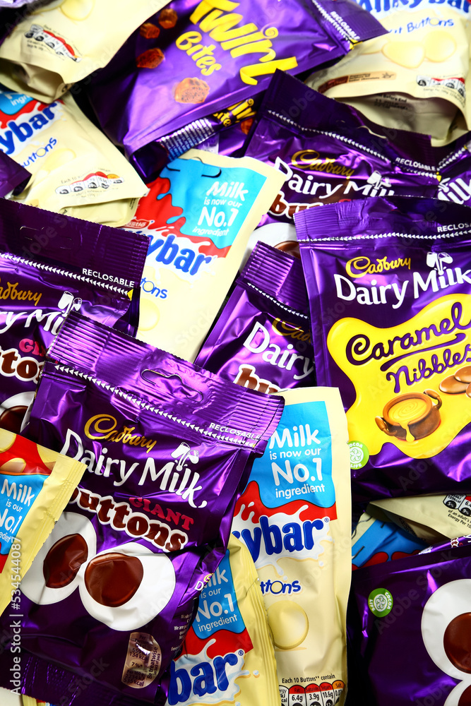 Packets of various chocholate snacks including cadbury twirl bites ...