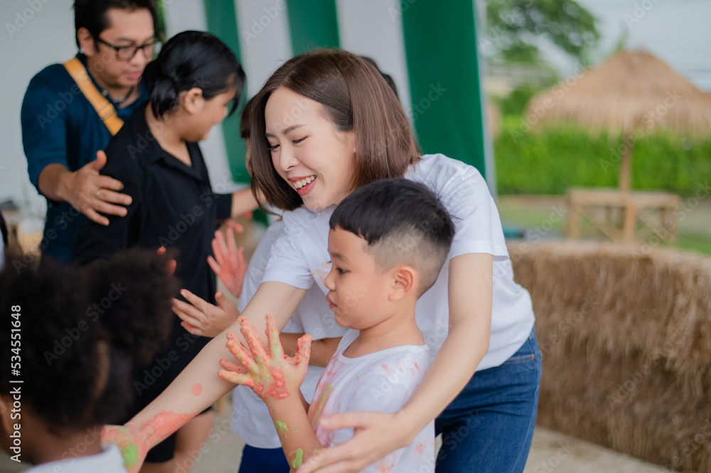 teacher and children playing color in Art join hand in hand fun ...