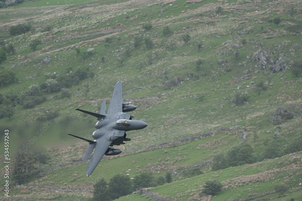 USAF F15 Eagle flying through Mach Loop in Wales at low level during ...