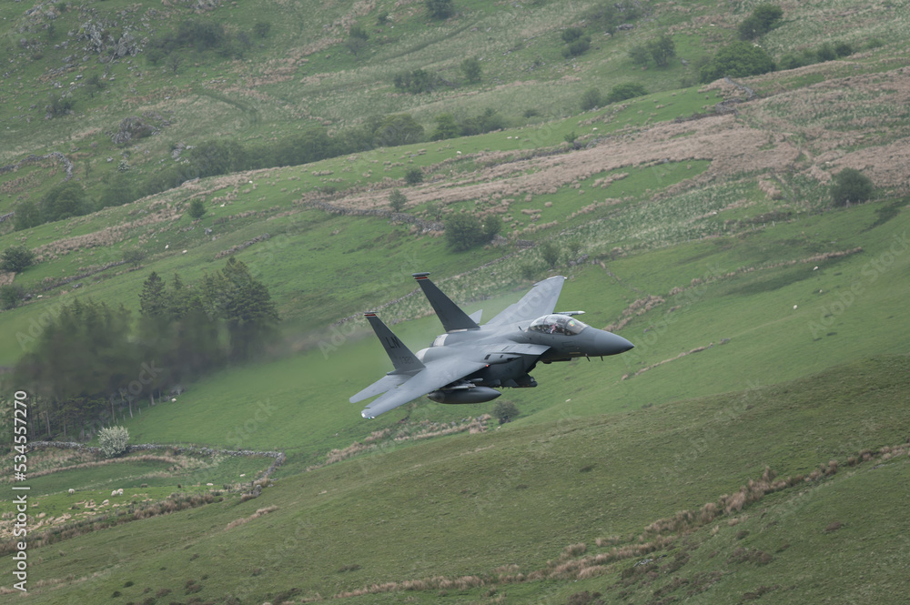 USAF F15 Eagle flying through Mach Loop in Wales at low level during ...